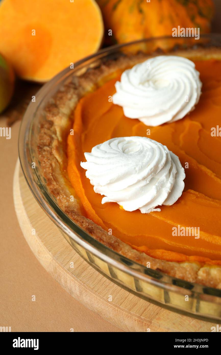 Concept of tasty food with pumpkin pie on beige background Stock Photo ...