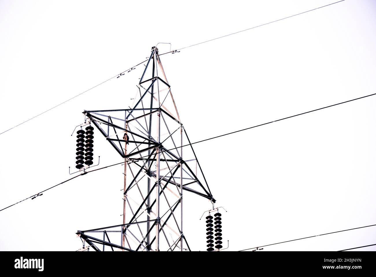 High-voltage electric power line against isolated white background ...