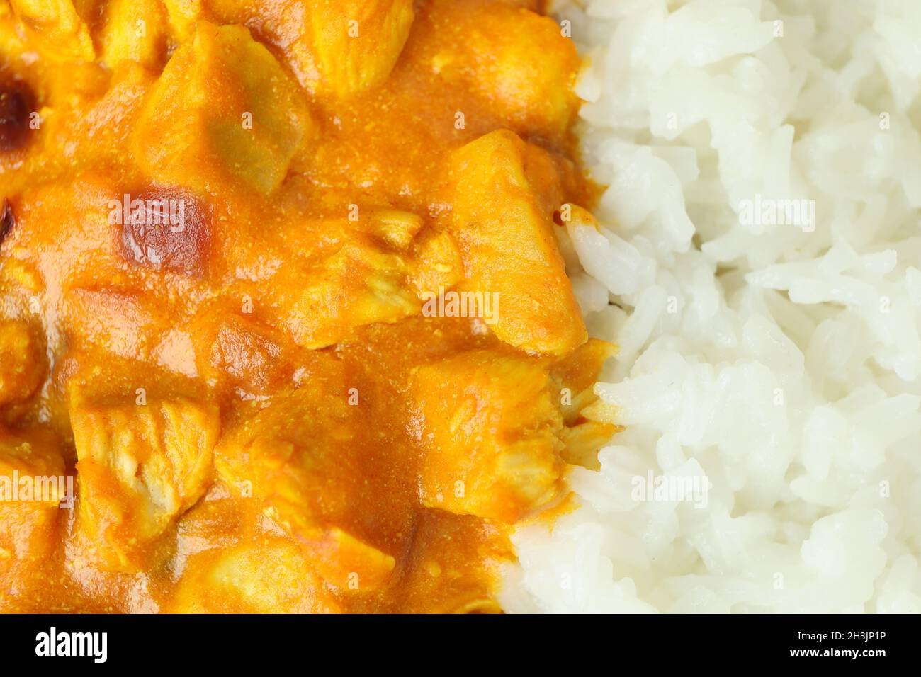 Chicken tikka with rice all over background, close up Stock Photo - Alamy