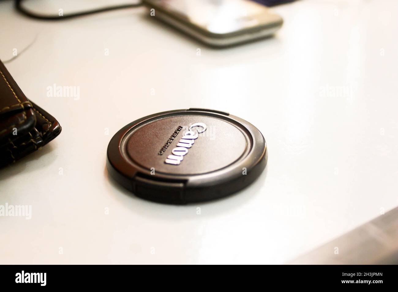 A Canon camera lens cap Stock Photo - Alamy