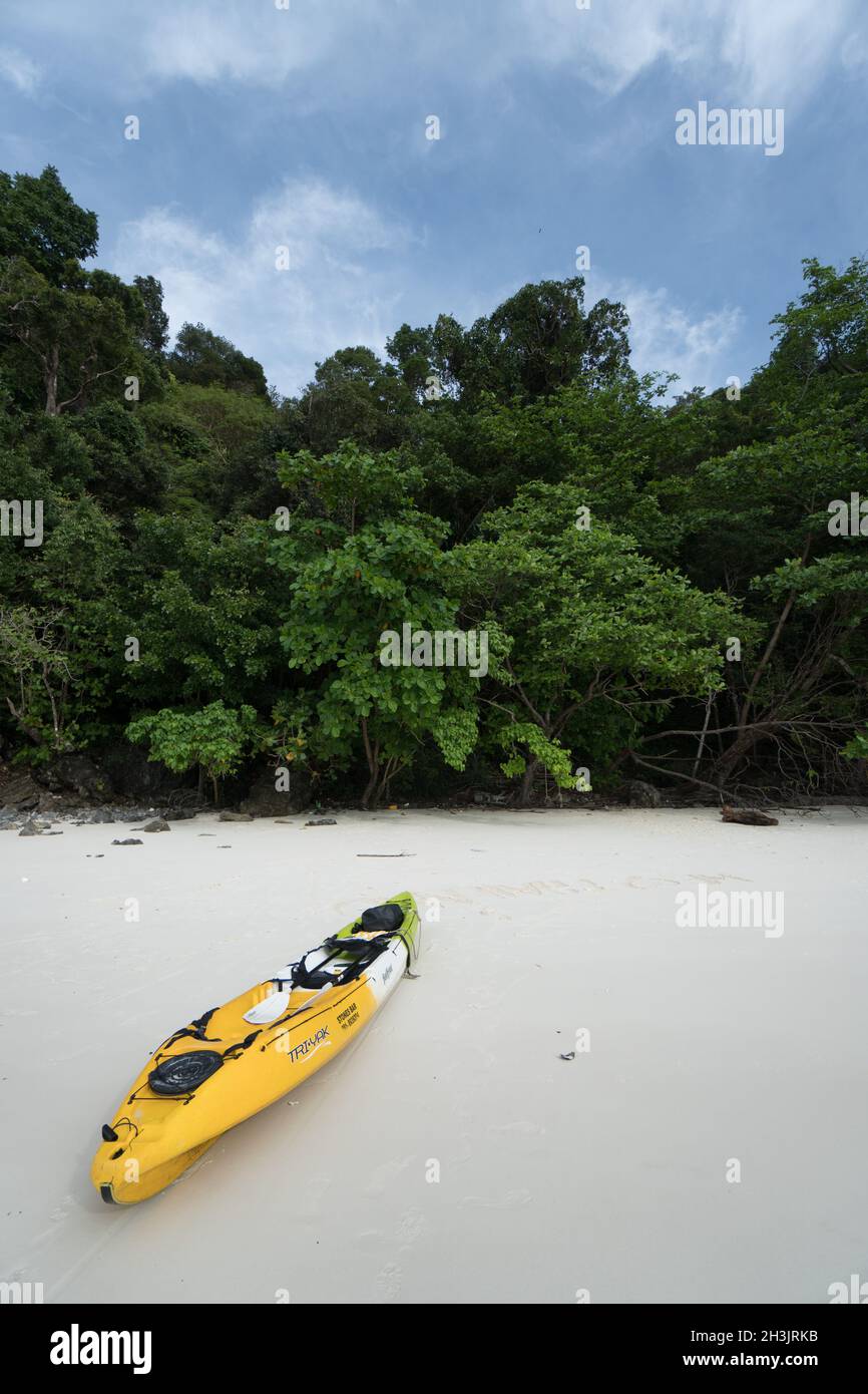 A yellow kayak on a tropical beach Stock Photo - Alamy