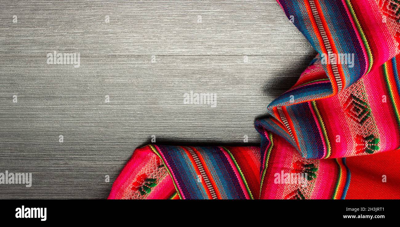 Red pattern tablecloth on wooden table for background. Fabric texture ...
