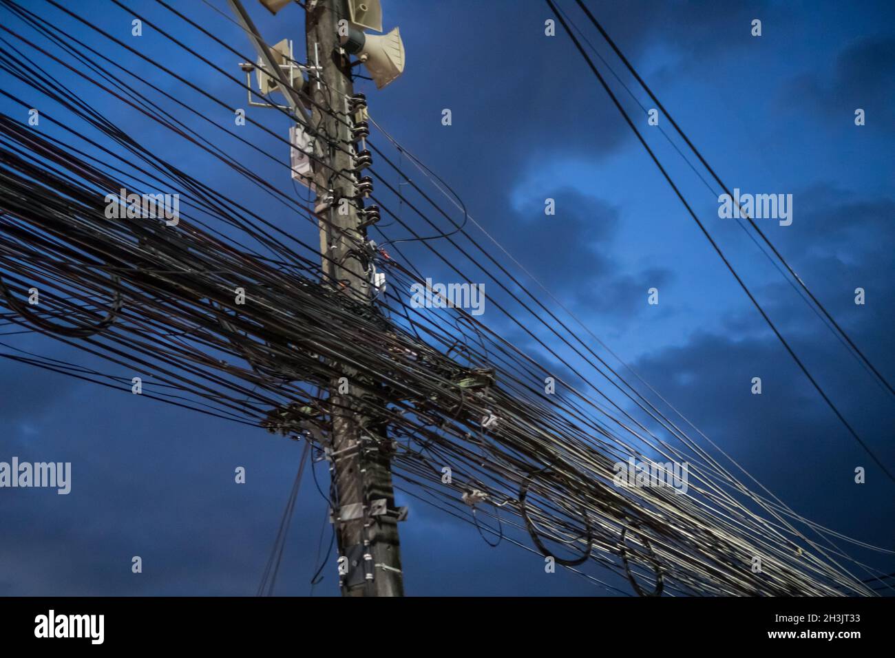 Mess of electric cables and telephone wires hi-res stock photography ...