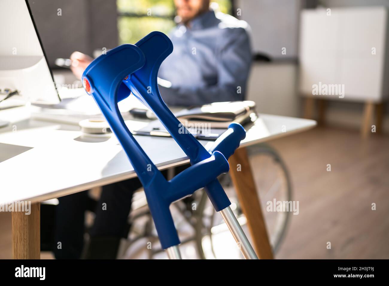 Businessman With Disabilities At Work Using Computer Stock Photo - Alamy