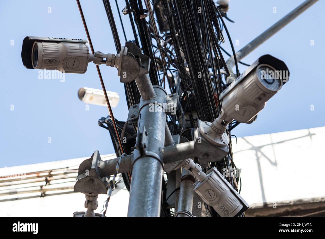 CCTV camera security and the chaos of cables and wires on every street ...
