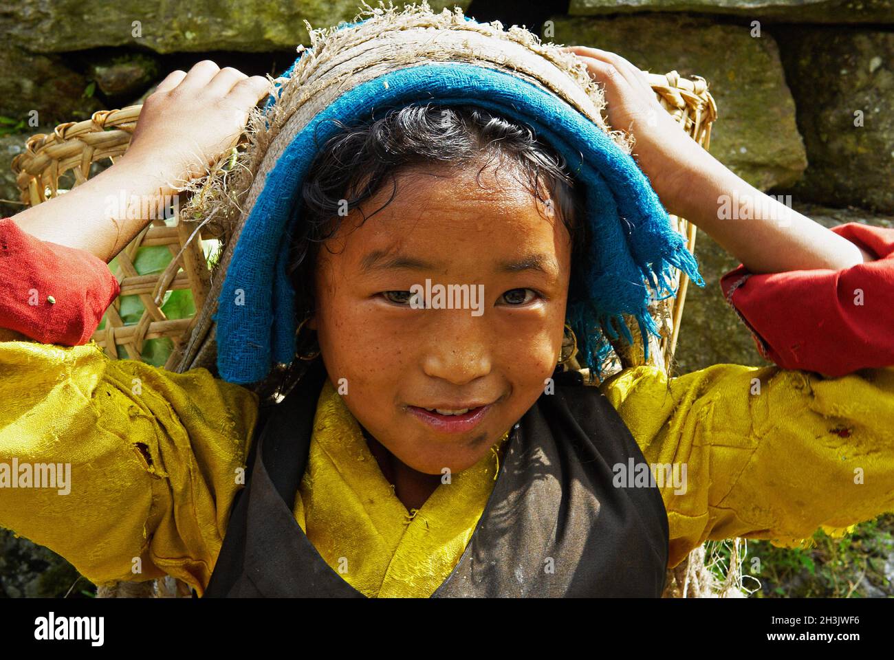 Nepal. Arun valley, East Nepal. Porter, the road rider of the Himalaya ...