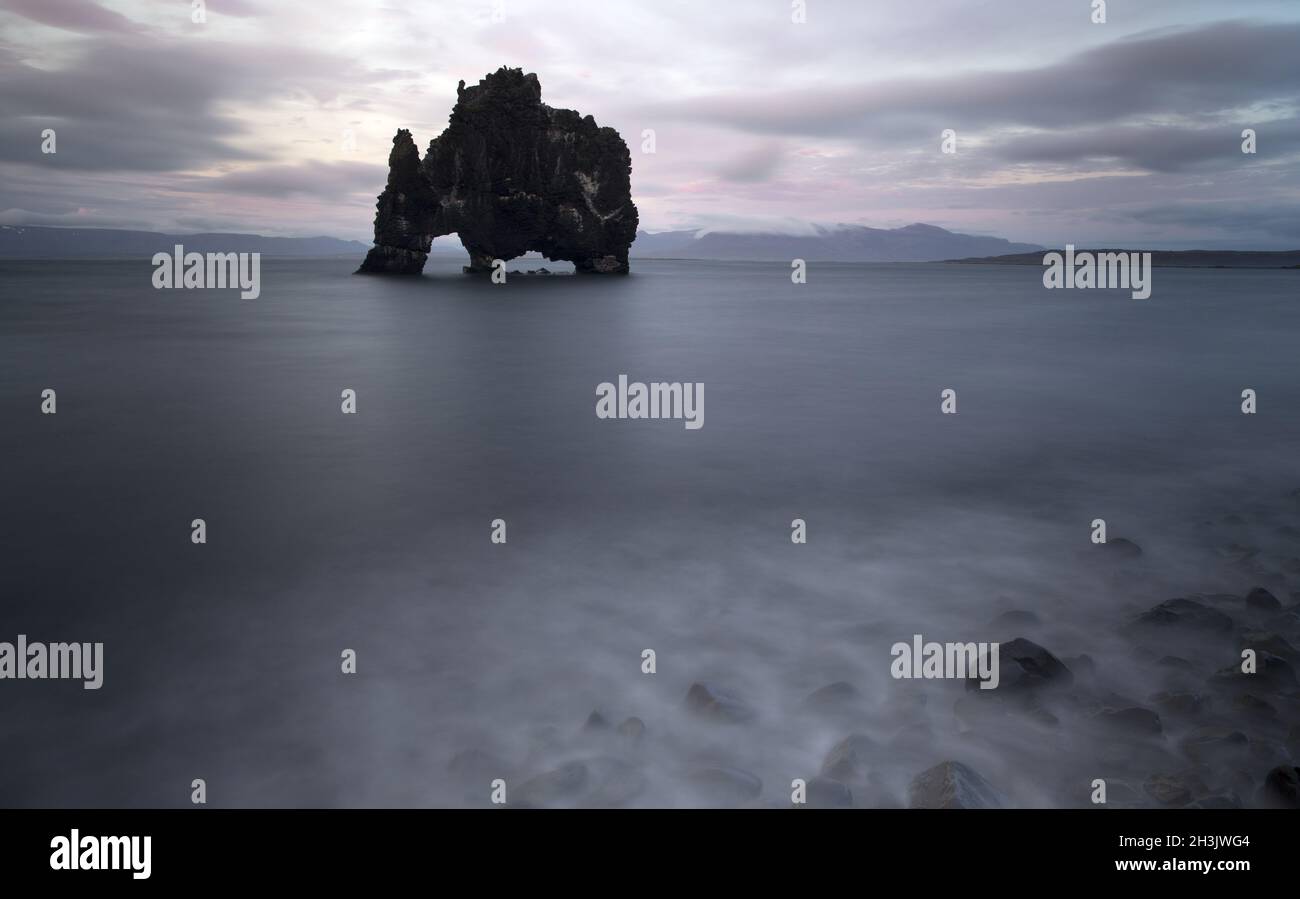 Drinking dragon, exposed rock in Iceland, seashore of the Atlantic ...