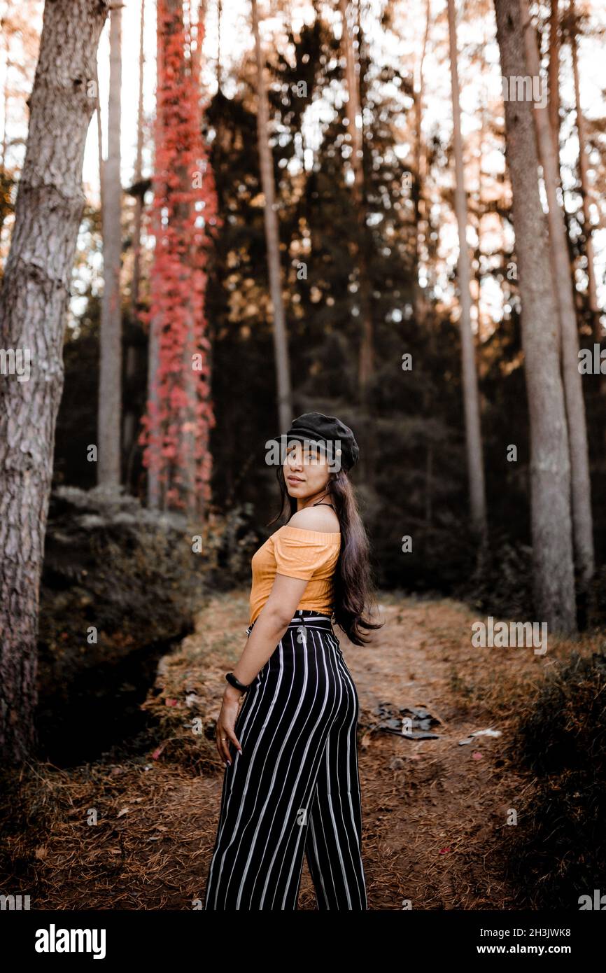 Young elegant Hispanic woman wearing a stylish newsboy female cap ...