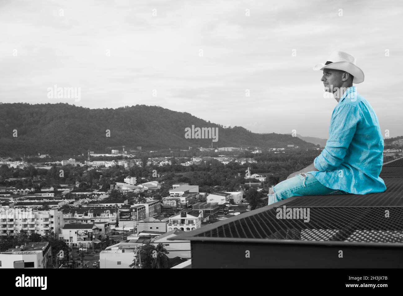 Man on roof edge hi-res stock photography and images - Alamy