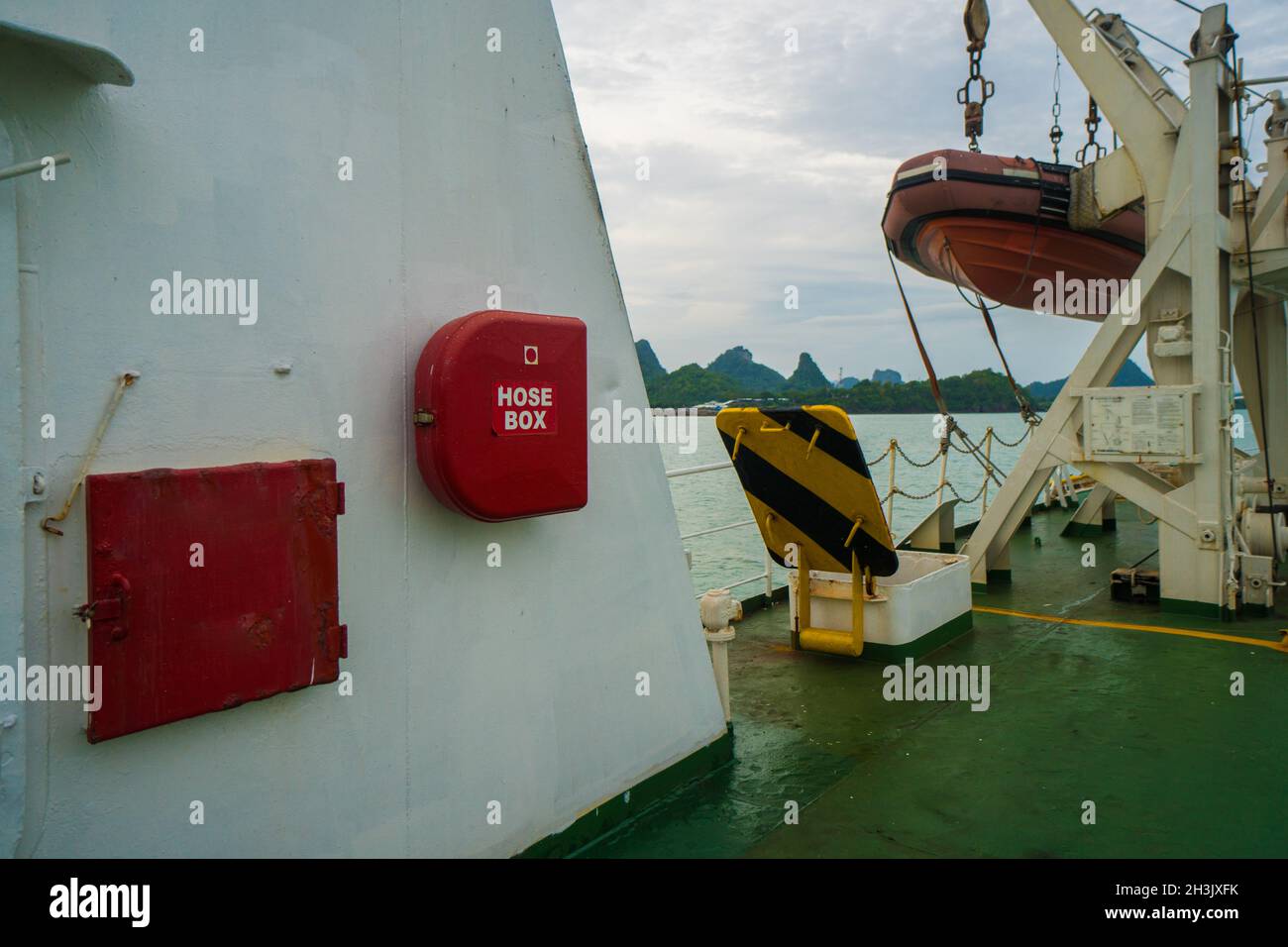 Fire hose cabinet and rescue motor-boat in the ferry ready for action ...