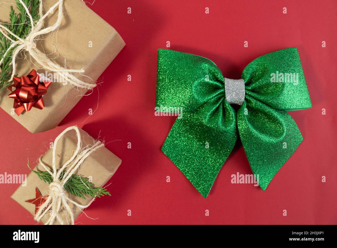 Noel gift boxes with big green ribbon, noel concept photo on red ...