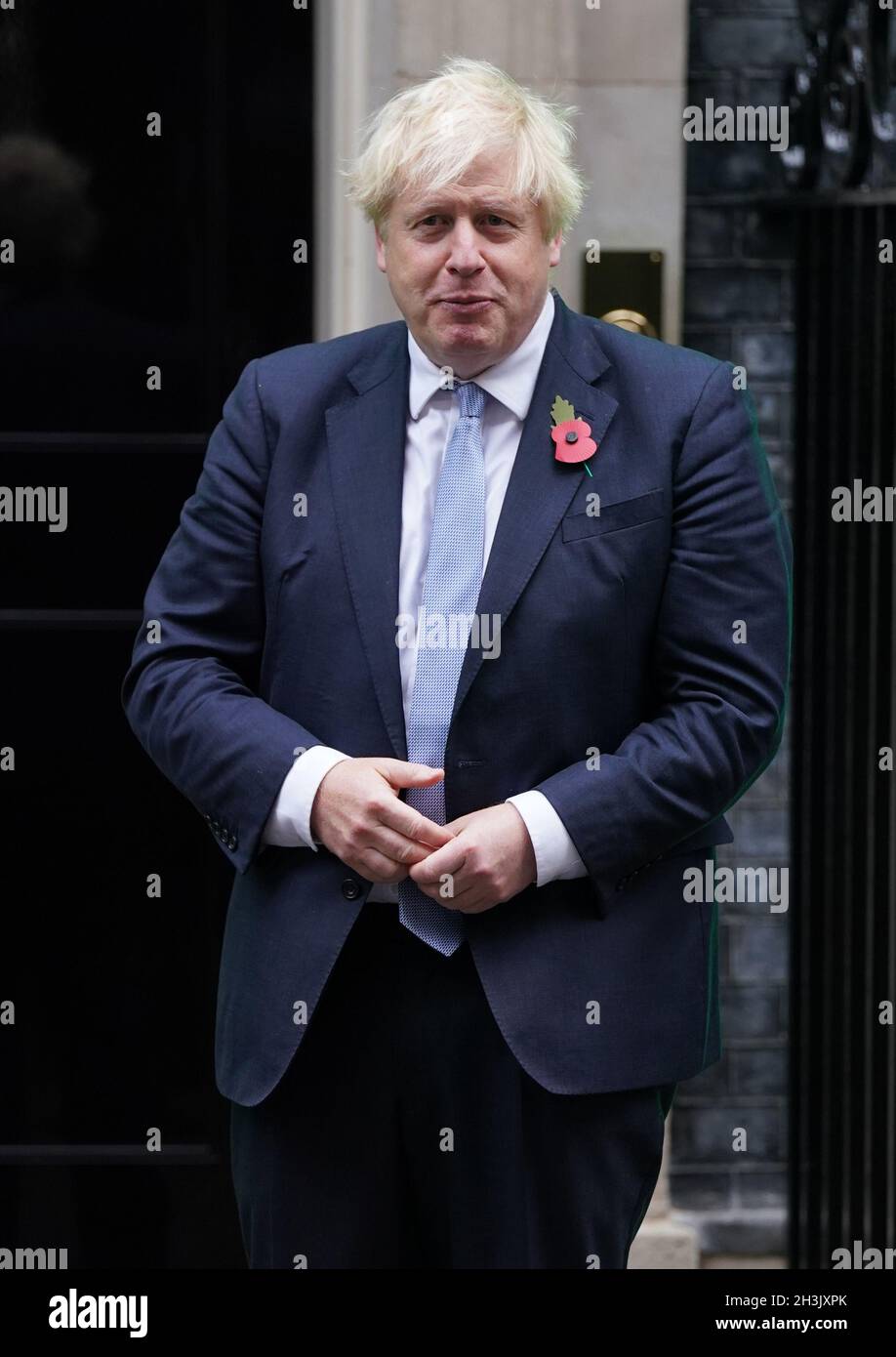 Prime Minister Boris Johnson poses in front of 10 Downing Street after ...