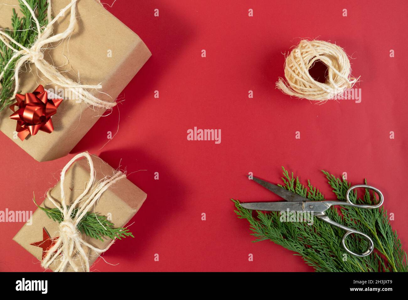 Top view christmas gift boxes with straw rope and scissors, christmas ...