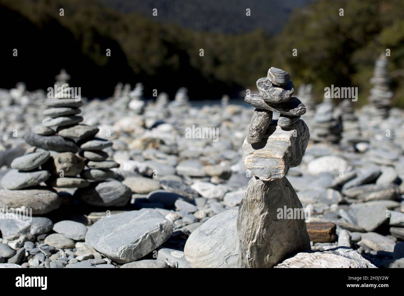 Rock cairns at Makarora river, South Island, New Zealand Stock Photo ...