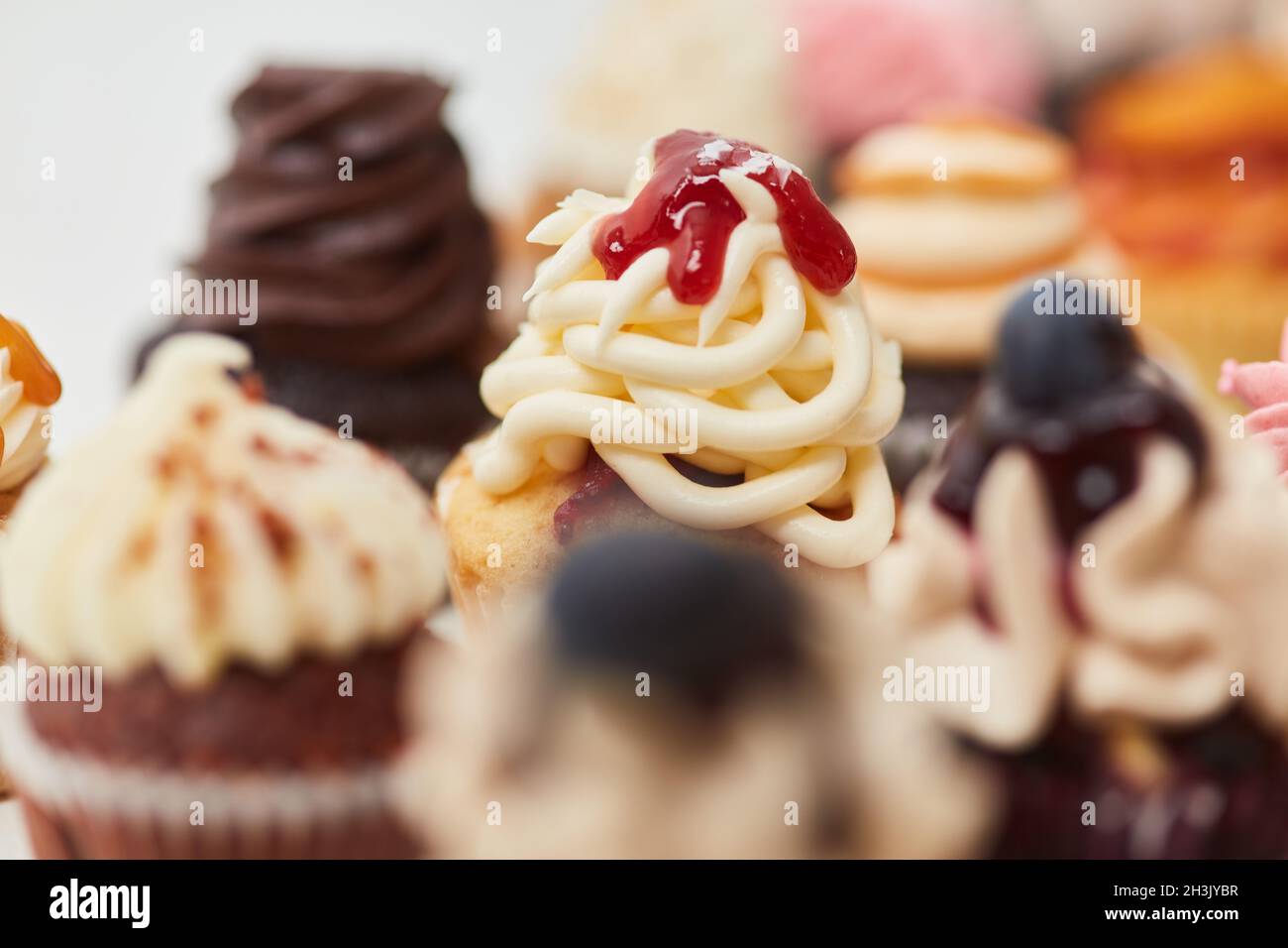 Colorful sweet cupcakes with decoration and toppings for birthday party ...