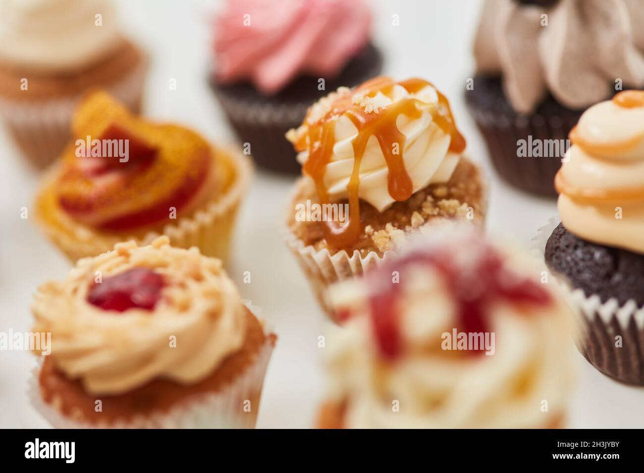 Colorful decorated cupcakes with toppings for birthday celebration ...
