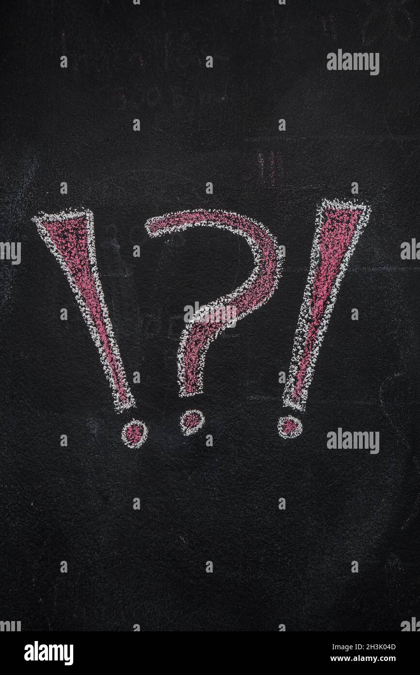 Question and exclamation marks on black chalkboard Stock Photo - Alamy