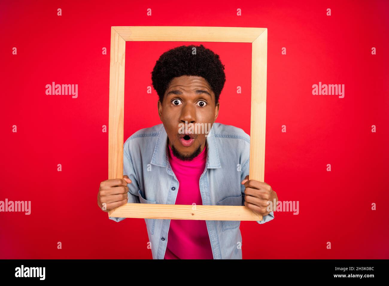 Photo of young black guy amazed shocked wooden frame omg wow reaction ...