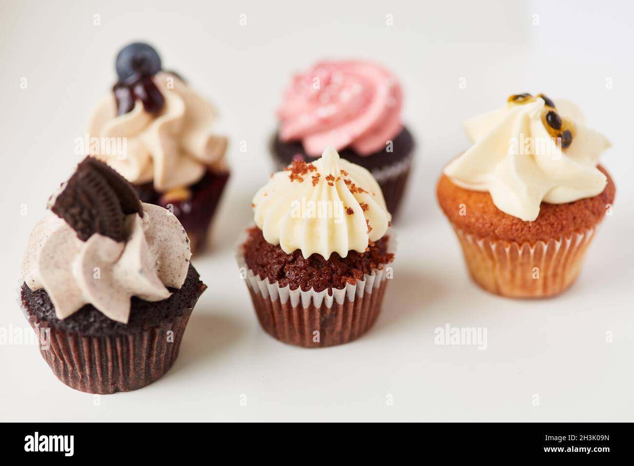 Five different cupcakes with different toppings and creams Stock Photo ...