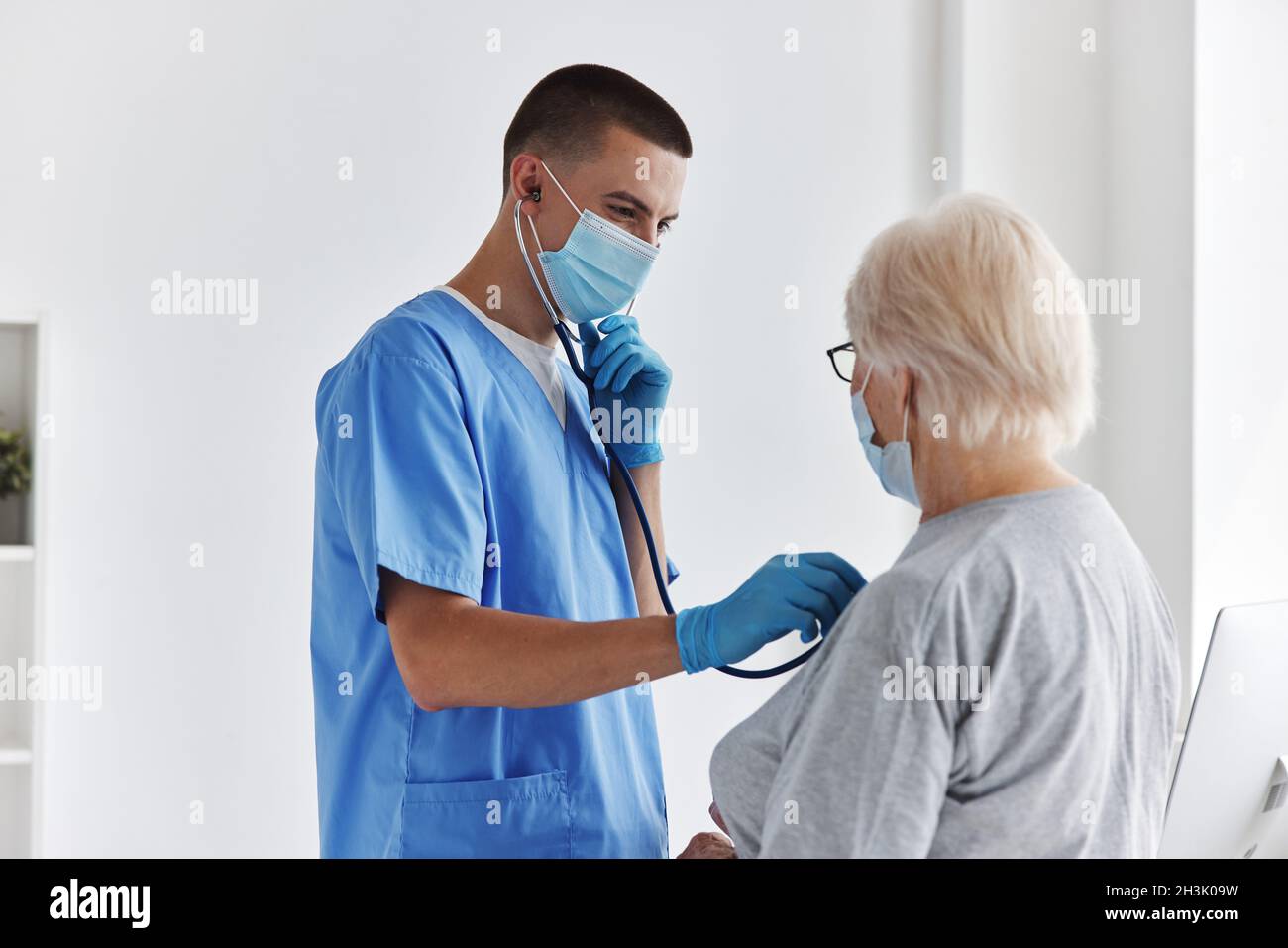 Medical worker examine sick mature hi-res stock photography and images ...