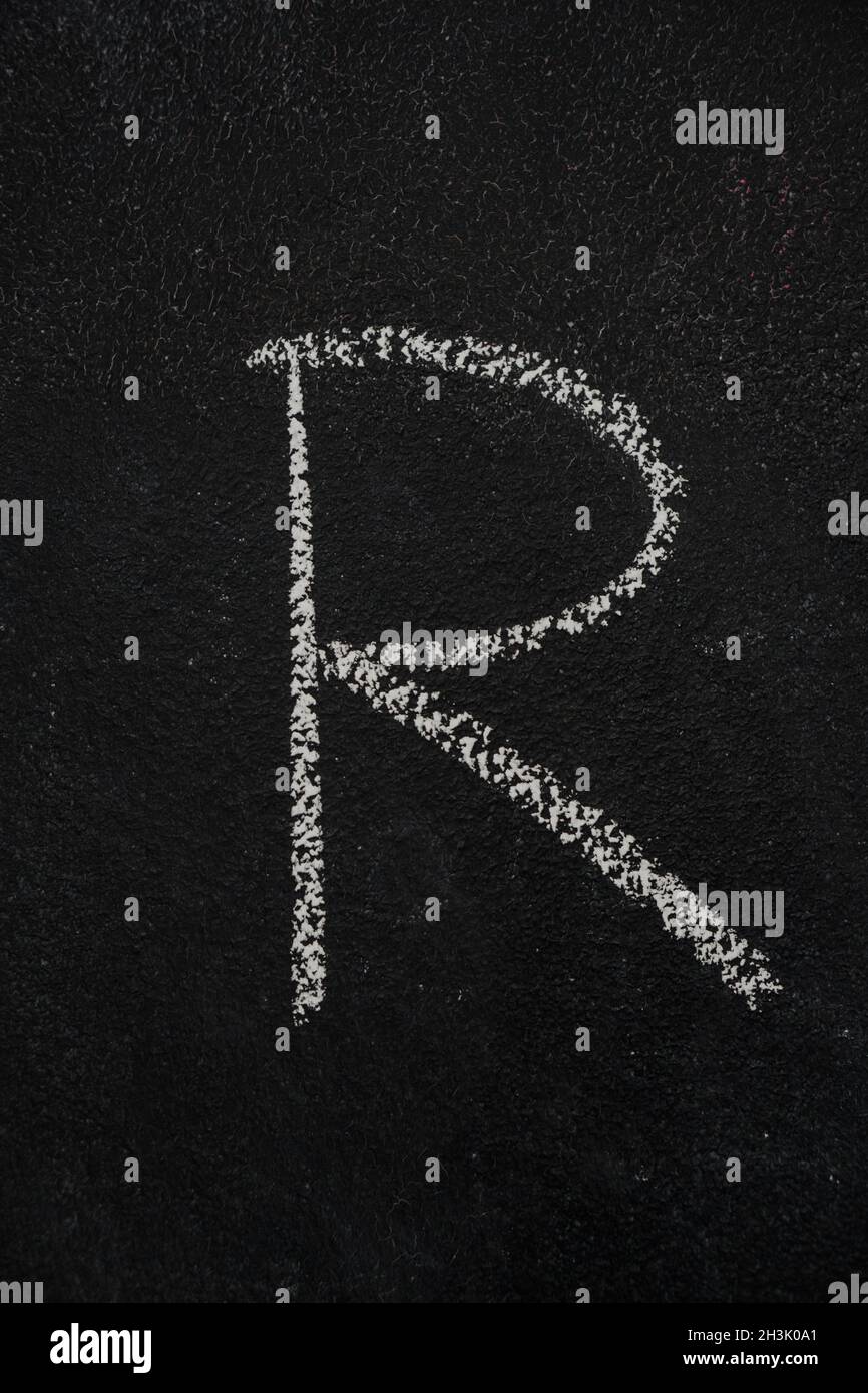 Letter R on black chalkboard Stock Photo - Alamy