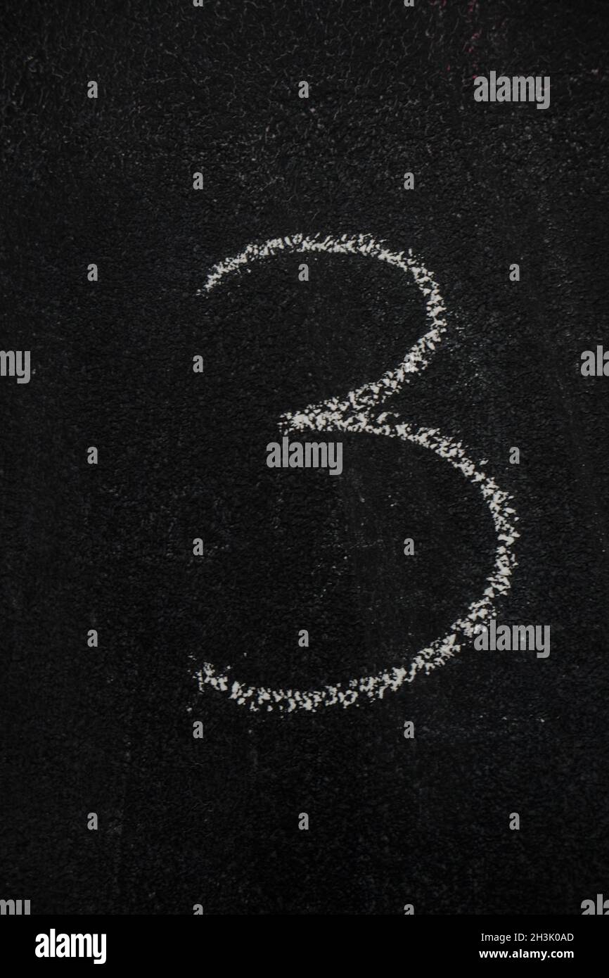 Number 3, three on black chalkboard Stock Photo - Alamy