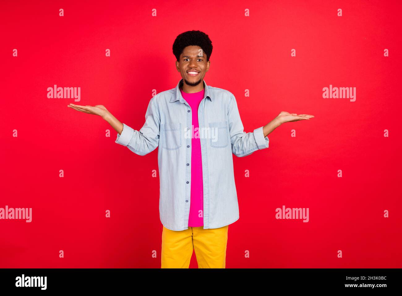 Photo of young afro guy happy positive smile hold hand advertise choice ...