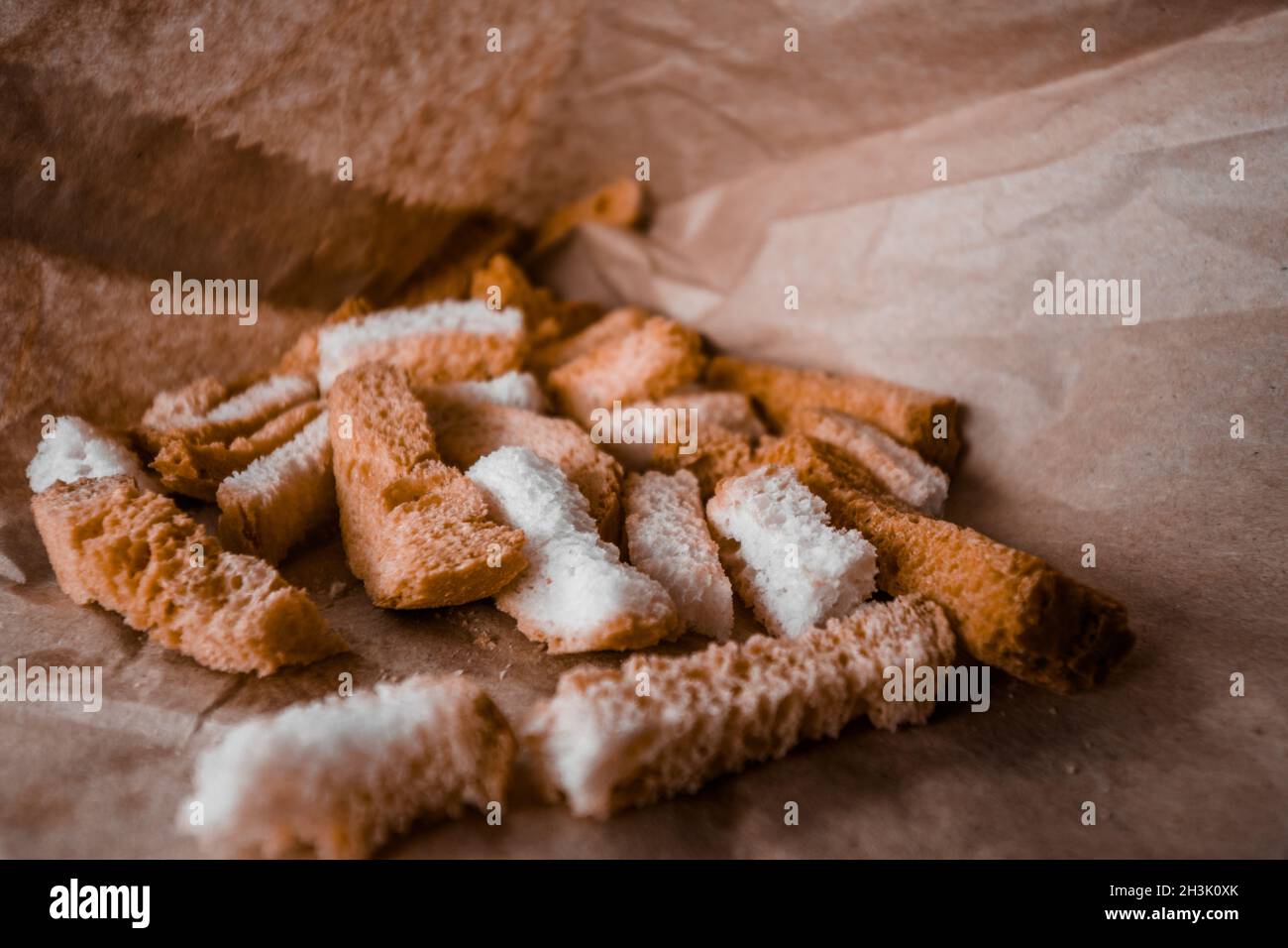 A pile of fried white bread croutons lie in craft paper Stock Photo - Alamy