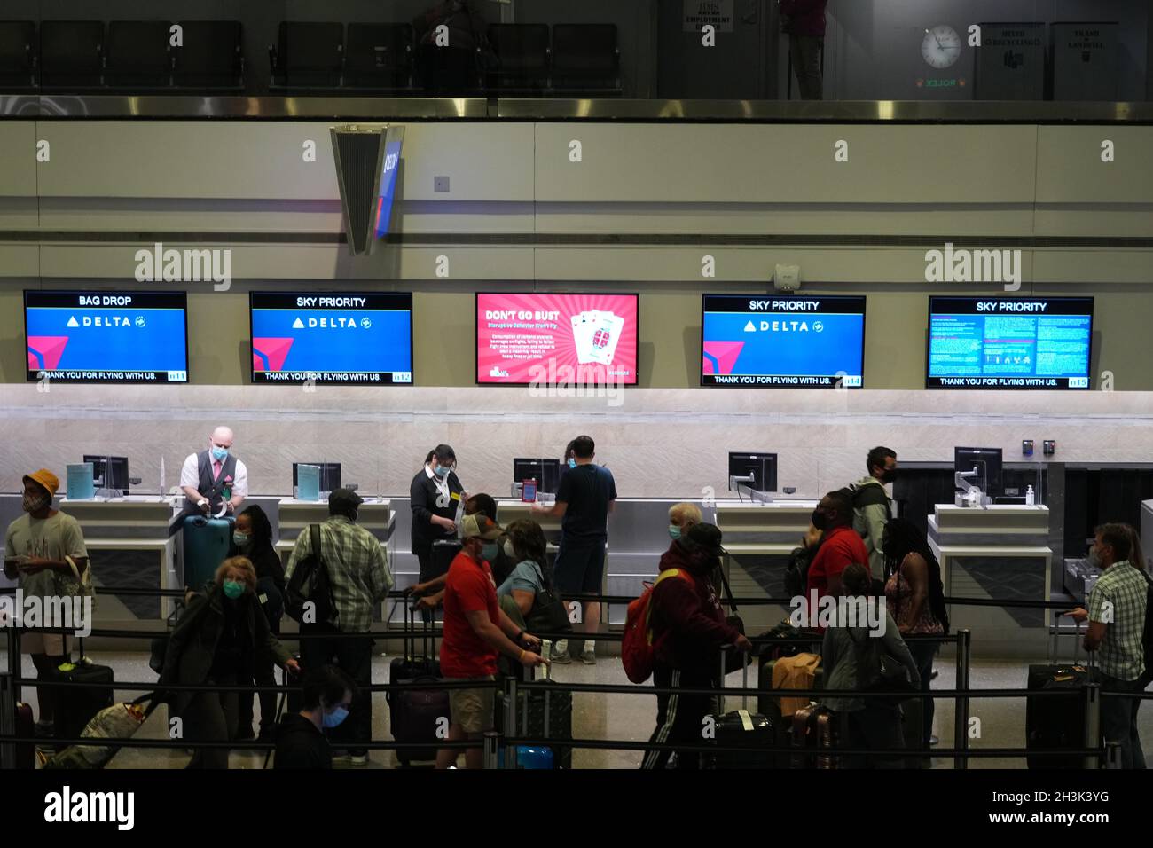 Passengers at Delta Airlines Slky Priority ticket counter at the ...