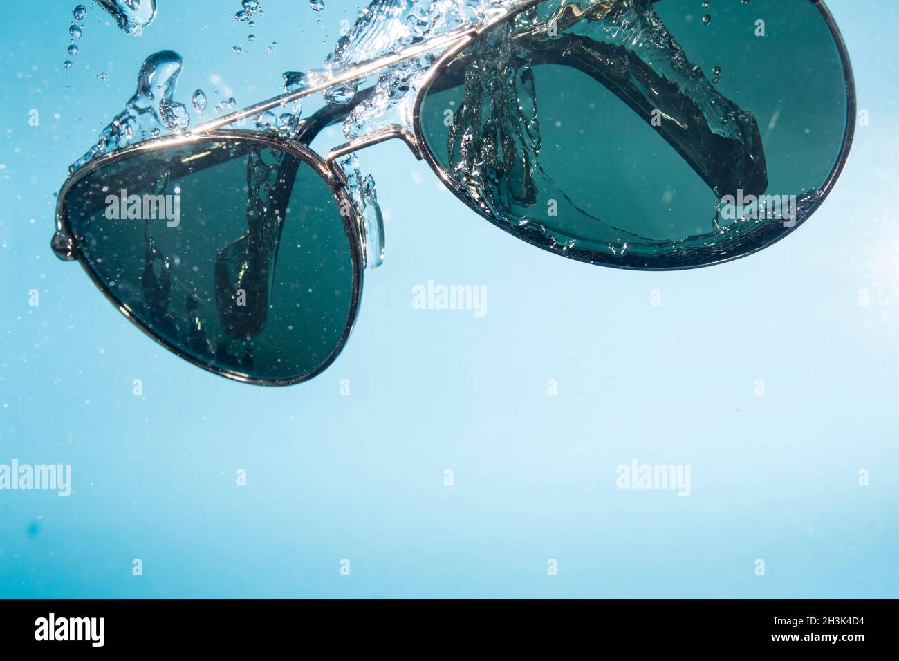 Sunglasses splash water hi-res stock photography and images - Alamy