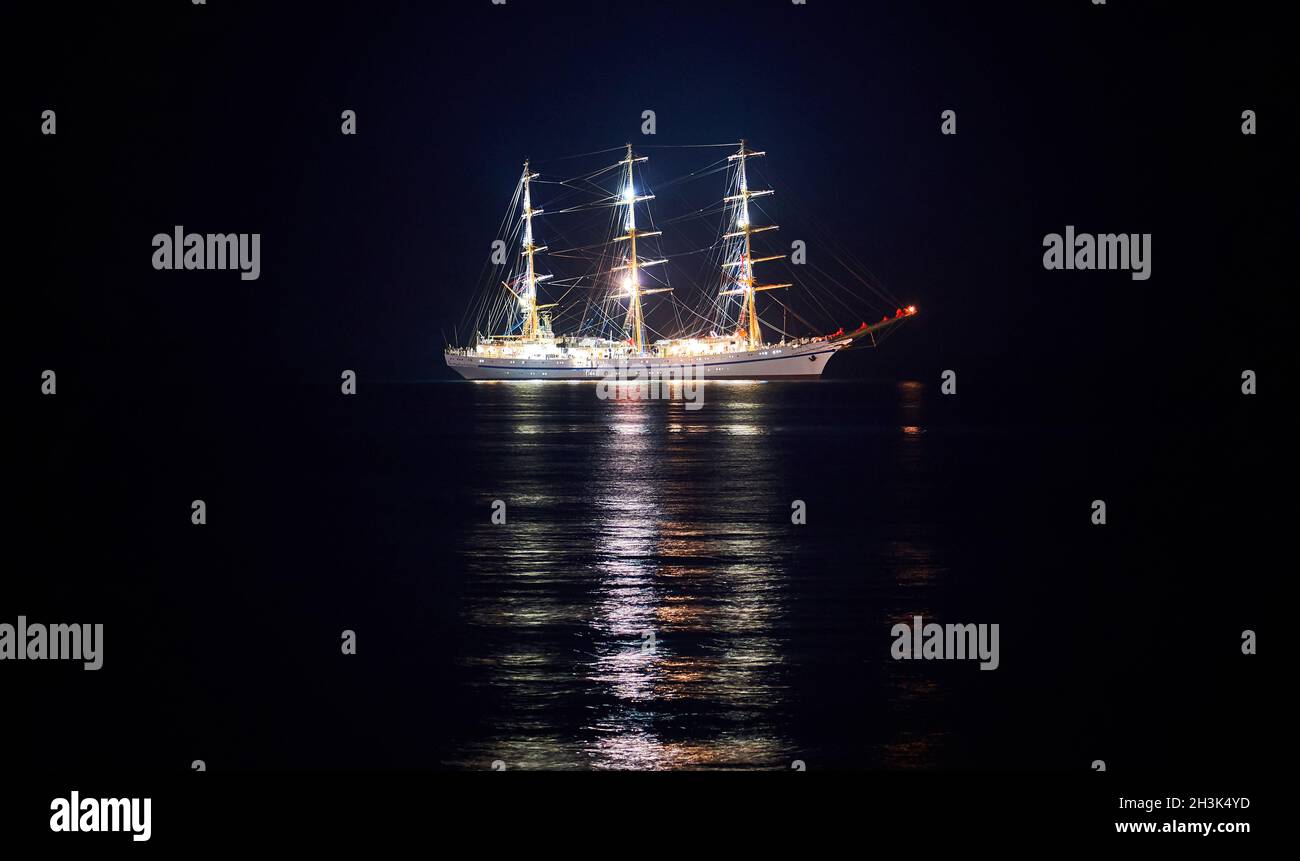 Illumination of a ship in the night ocean with copy space Stock Photo ...