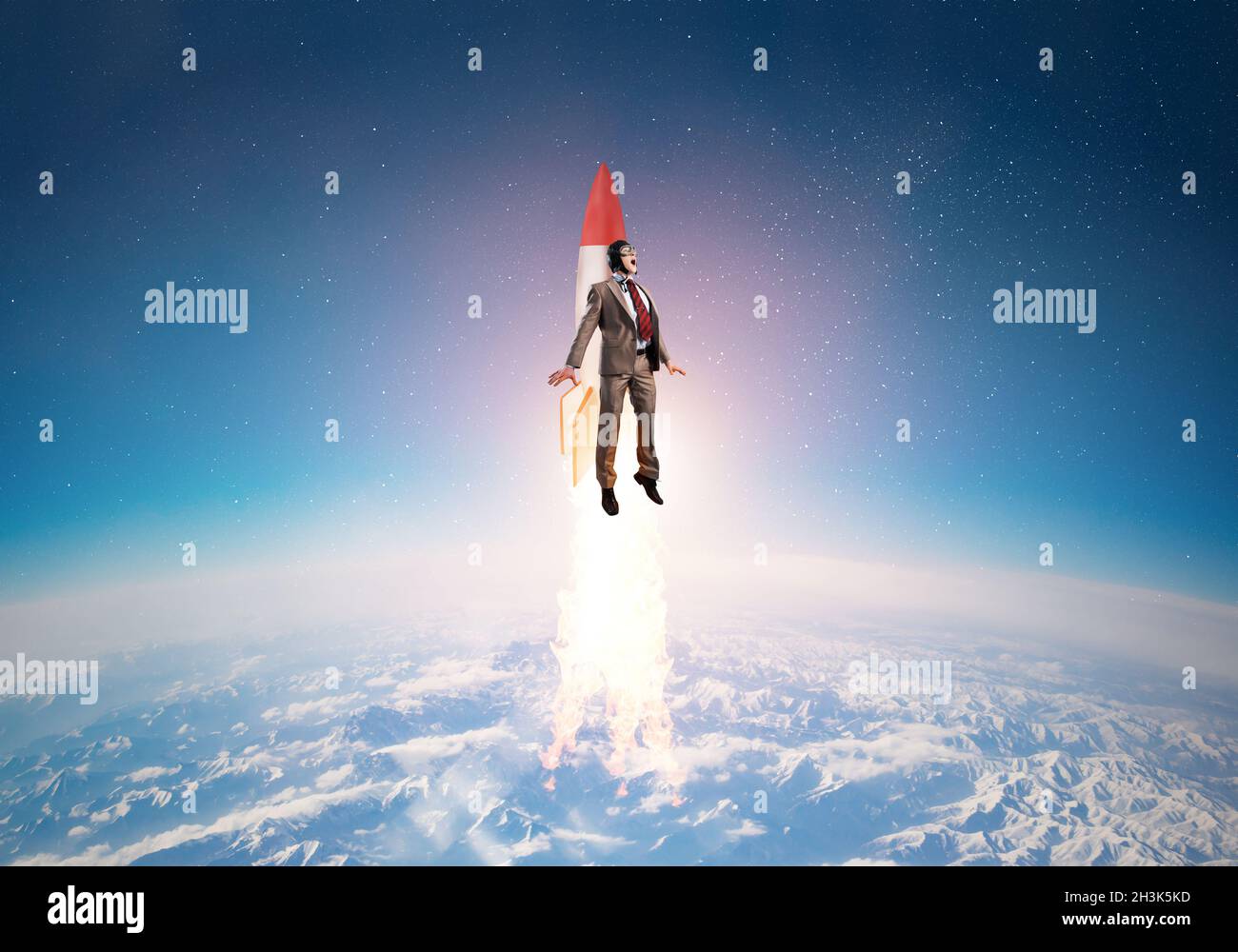 Business person in aviator hat flying on rocket Stock Photo - Alamy