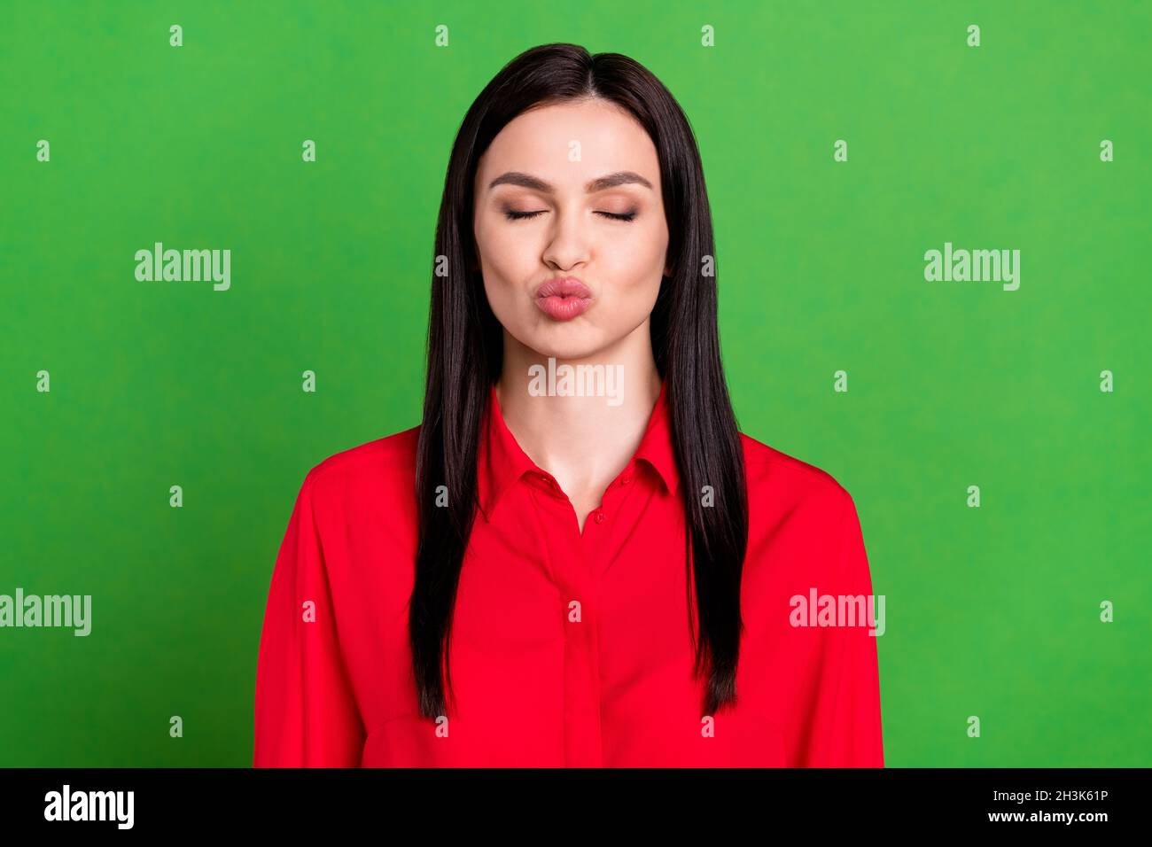 Portrait Of Attractive Amorous Dreamy Girl Sending You Air Kiss
