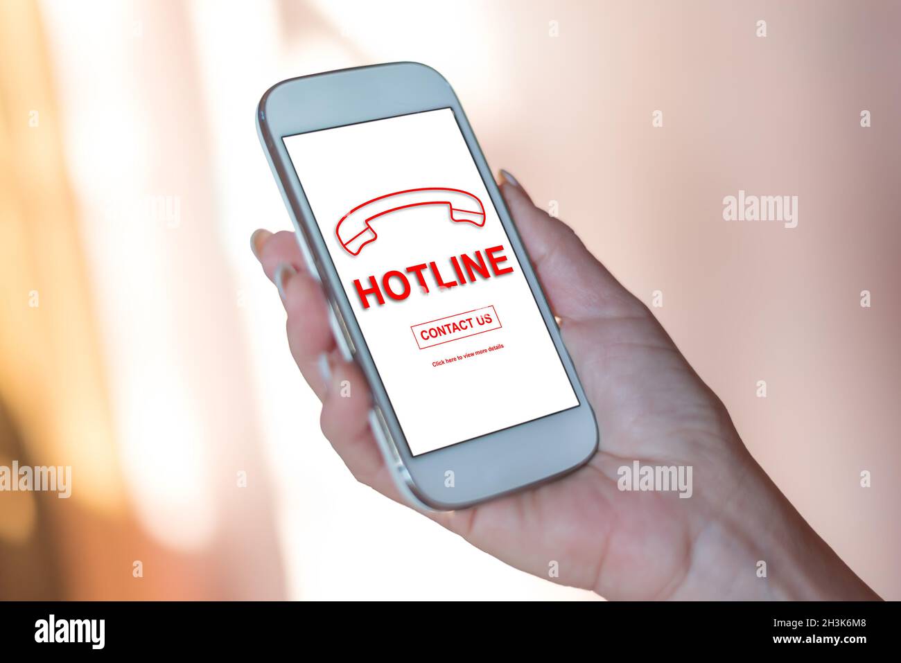 Smartphone screen displaying a hotline concept Stock Photo - Alamy