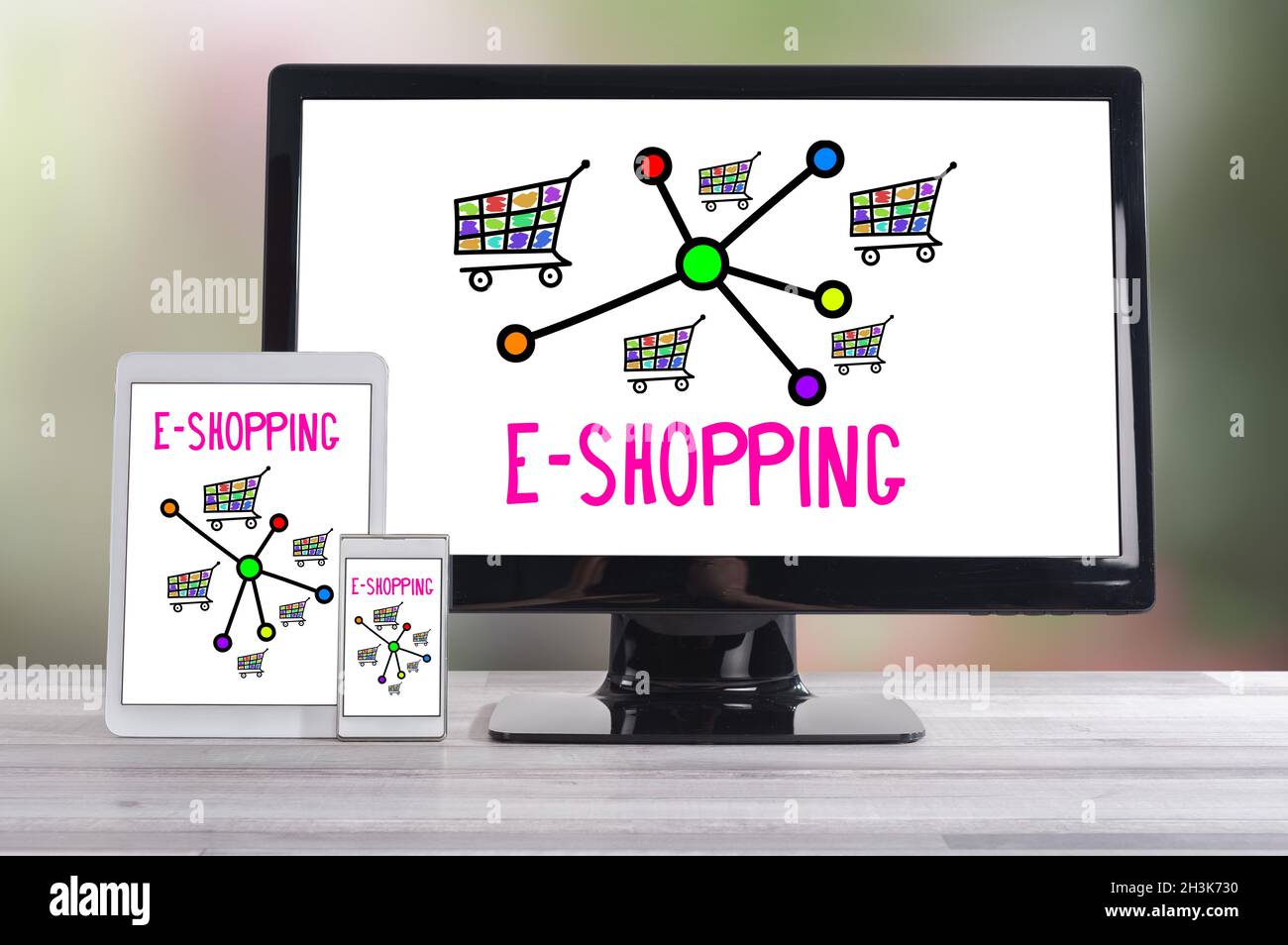 E-shopping concept shown on different information technology devices ...