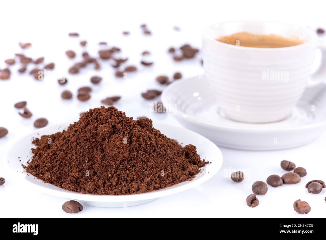 Expresso and coffee powder, isolated on white Stock Photo - Alamy