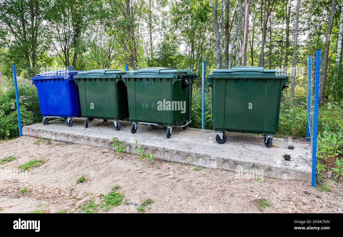 Plastic garbage containers at the outdoors in summer sunny day Stock ...
