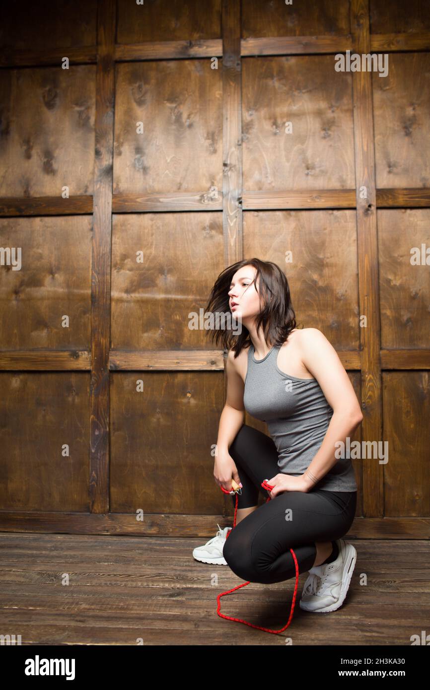 Brunette girl with rope Stock Photo - Alamy