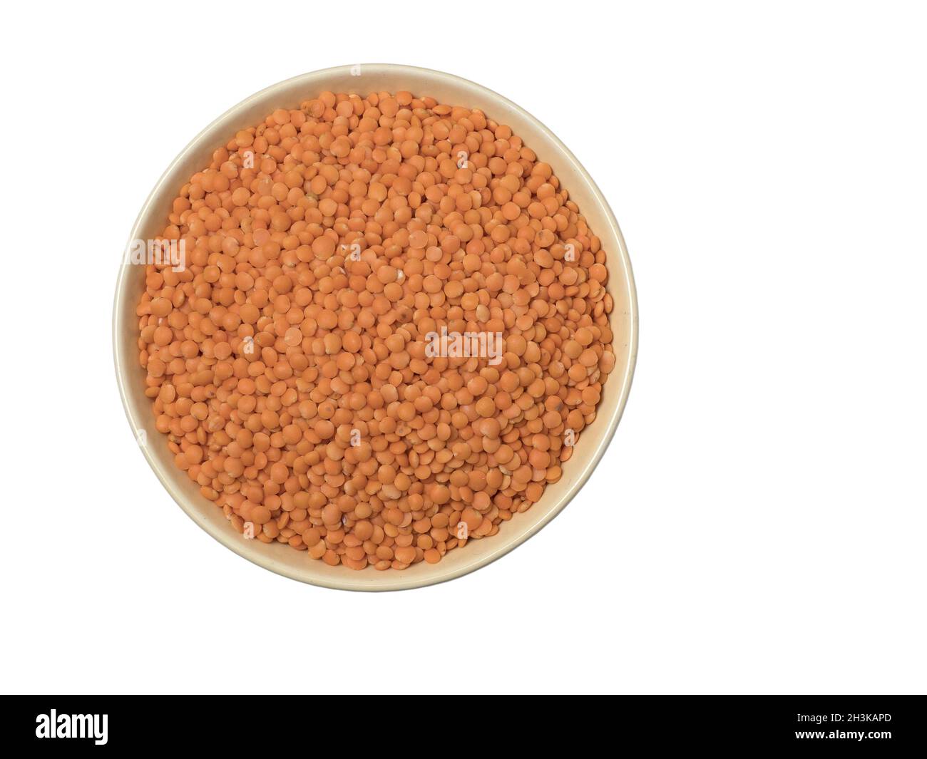 Bowl of red split lentil isolated on white background, top view Stock ...