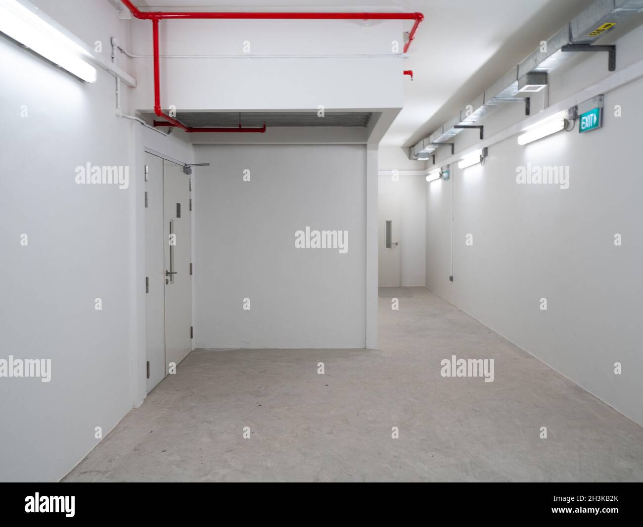 Empty basement hallway Stock Photo - Alamy