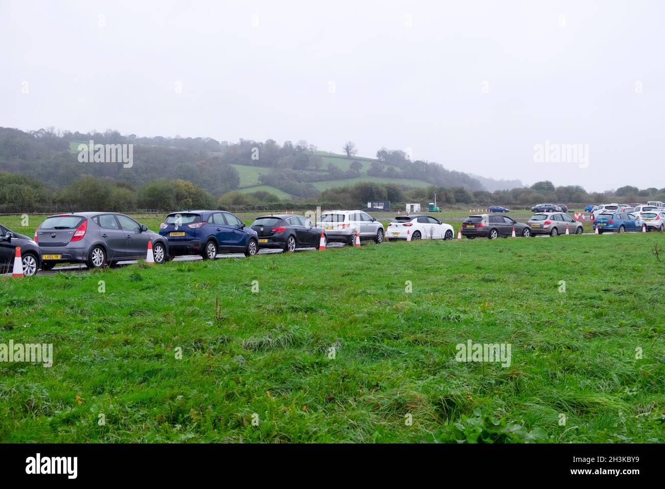 People queuing in row line queue of cars to get coronavirus Pfizer ...