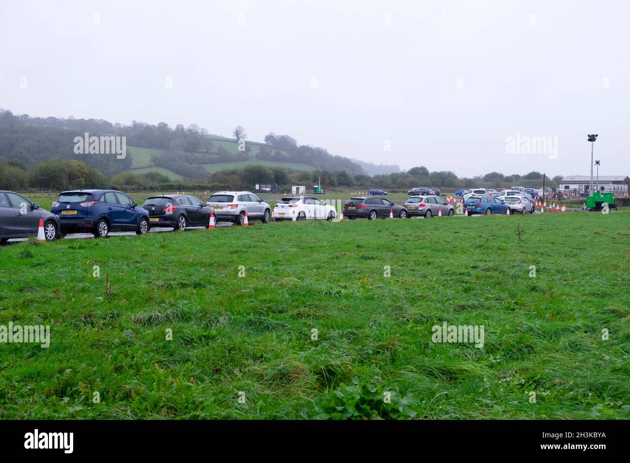 People queuing in row line queue of cars to get coronavirus Pfizer ...