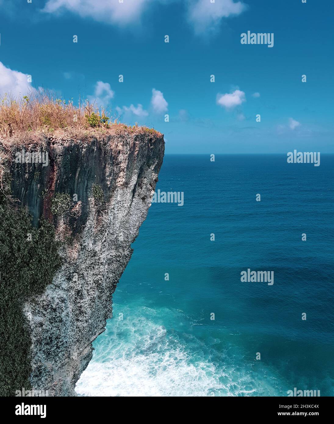 Beautiful cliff over sea and sky background in Bali Stock Photo - Alamy