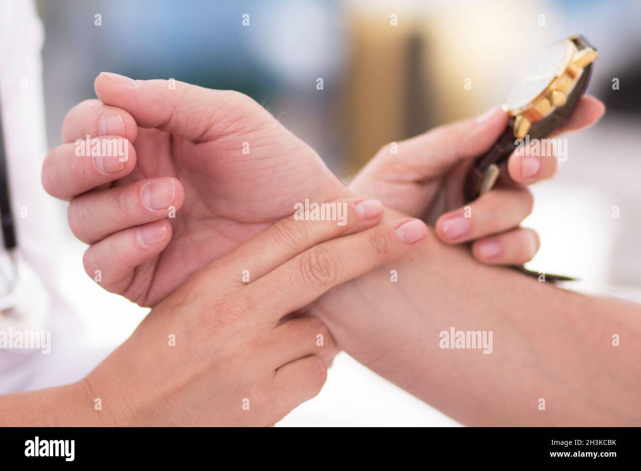 Nurse checking patients pulse Stock Photo - Alamy