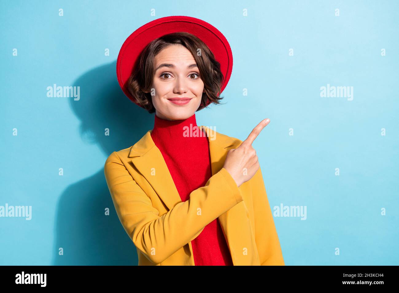 Photo of young girl happy positive smile point finger empty space ad ...