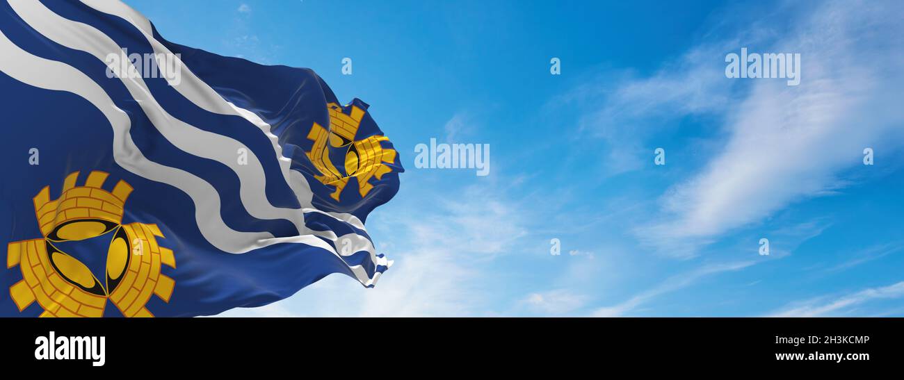 flag of county Merseyside, UK at cloudy sky background on sunset ...