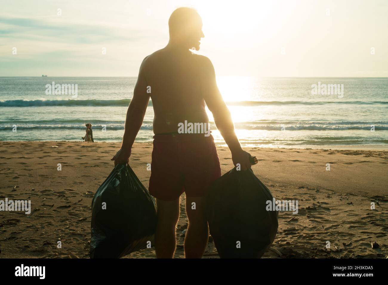 Man cleaning the beach Stock Photo - Alamy