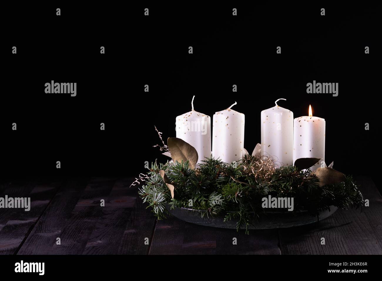 First Advent - Advent wreath from fir and evergreen branches with white ...