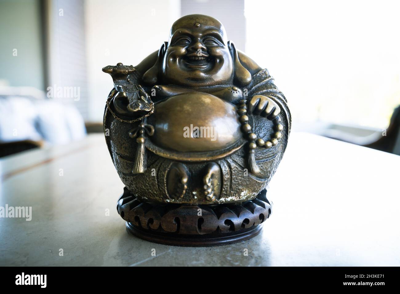 Laughing Buddha of abundance, joy and happiness golden color statue ...