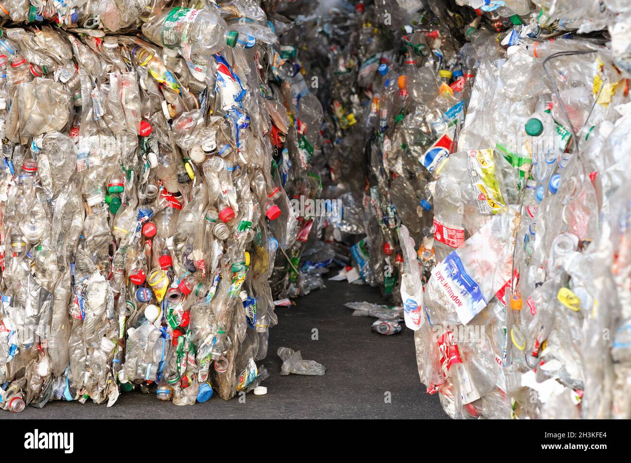 Compressed plastic bottles in stacks at the recycle factory Stock Photo ...